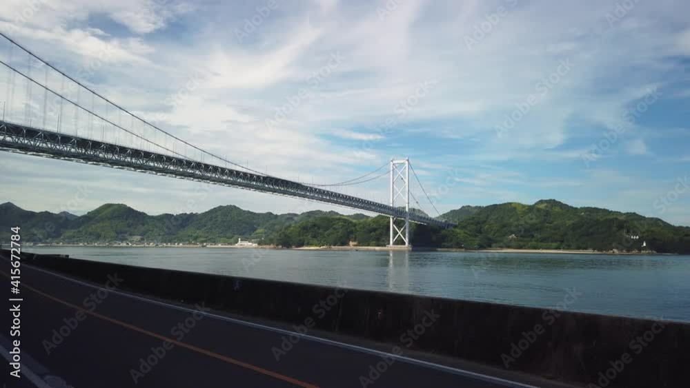 Suspension bridge over islands in Japans inland sea the Setouchi, Pan ...