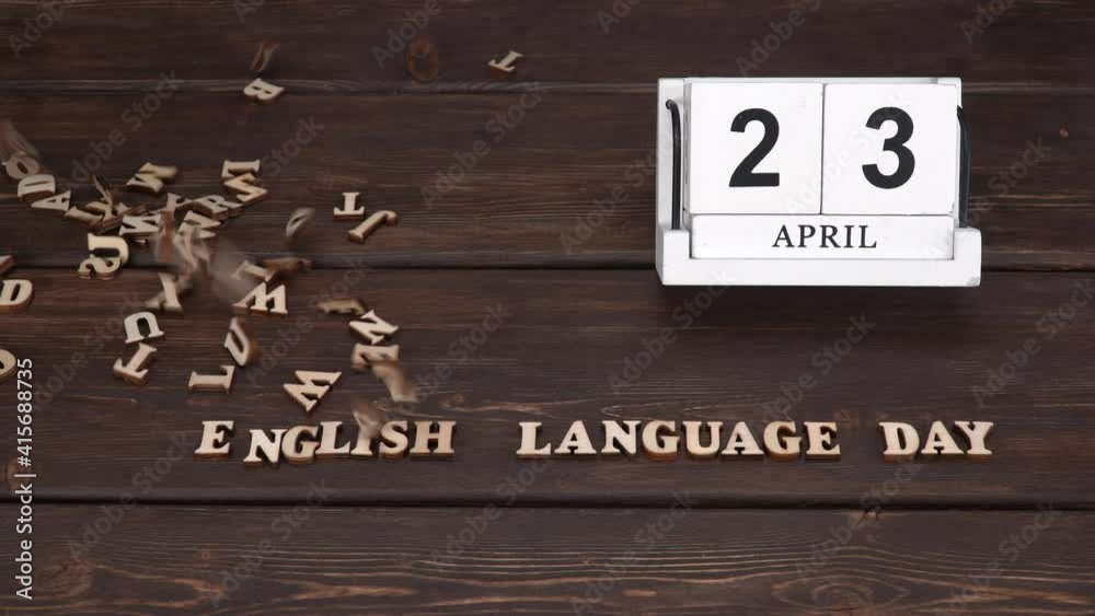 April 23, date on the calendar. English Language Day. Handmade wood ...