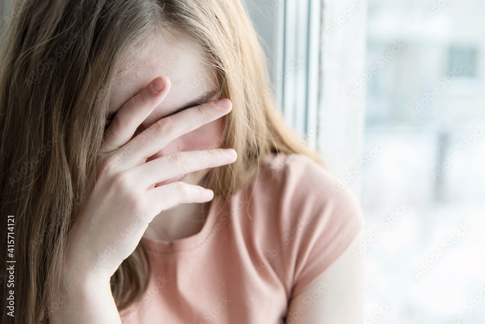 The concept of depression, the sadness of a teenager. The teenage girl ...