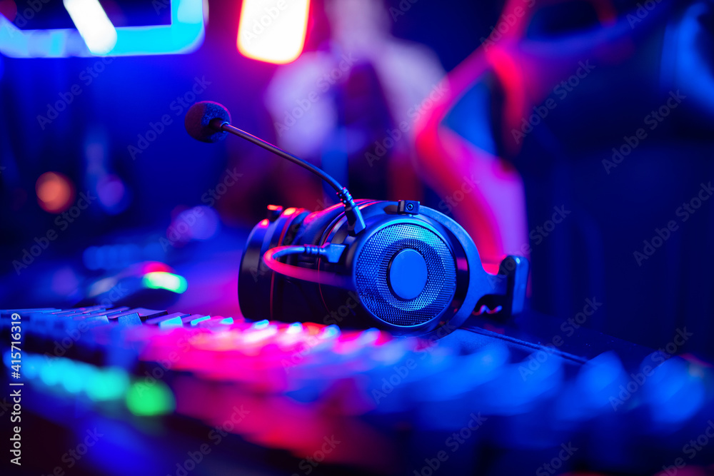 Headphones with microphone for video games and cyber esports on neon ...