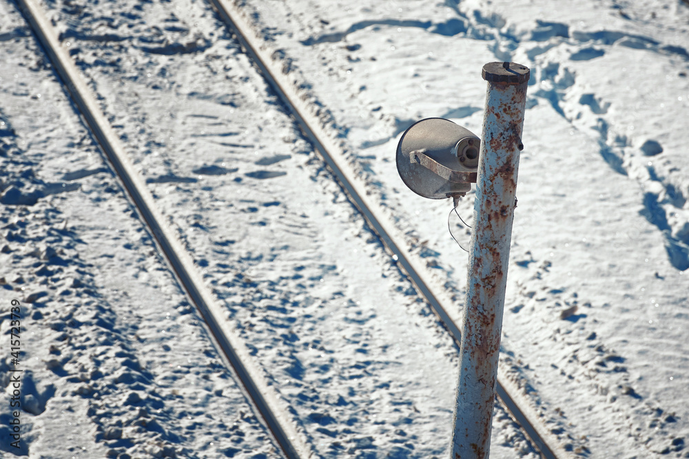 Foto de Loudspeaker at the pole on railroad tracks. Old megaphone on ...