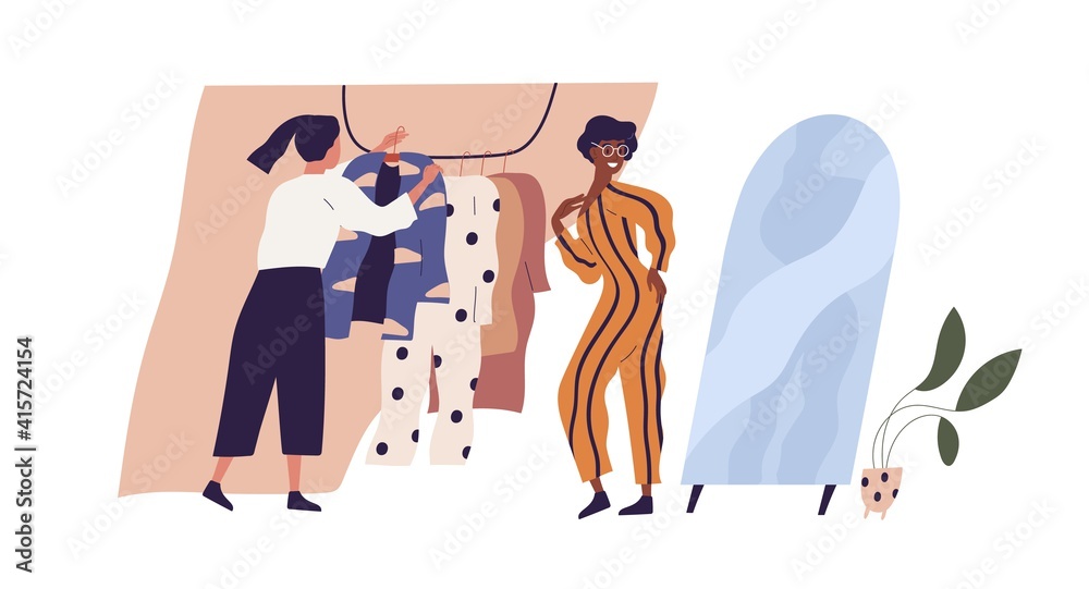 Shop assistant and happy dark skinned woman during clothes fitting in ...