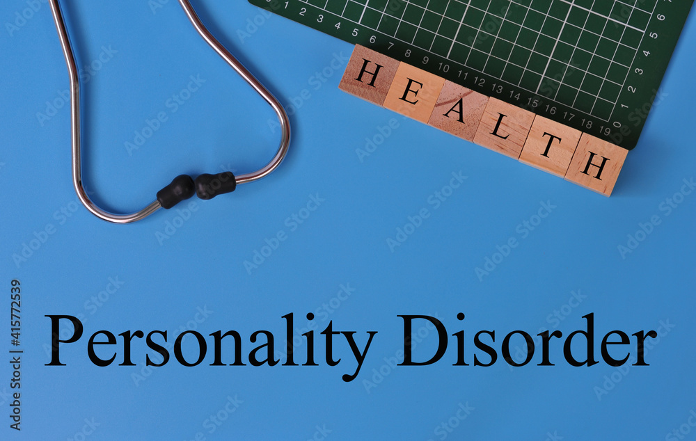 Layout of Stethoscope, graph pad and wooden block with the text ...