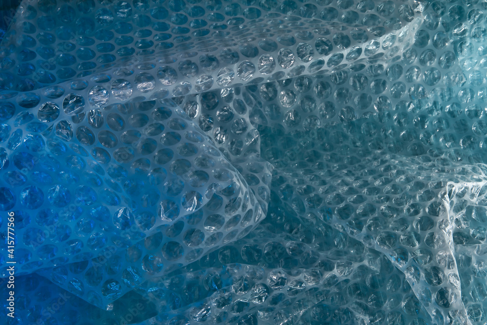 Blue bubble wrap texture. Abstract light blue neon background. Flat lay ...