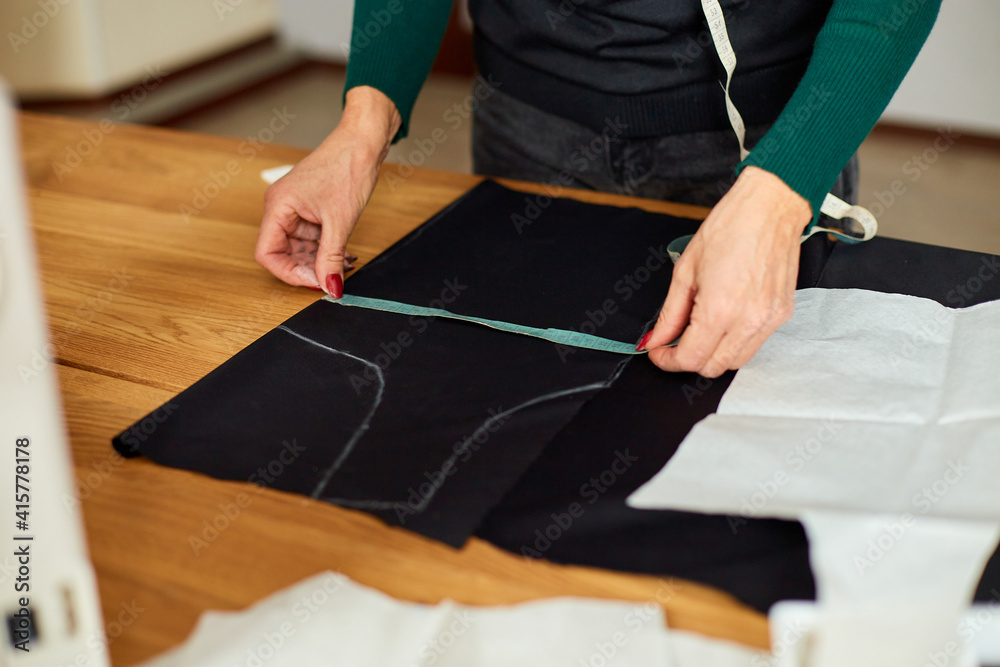 Step by step, woman dressmaker female measuring sewing pattern On Table ...