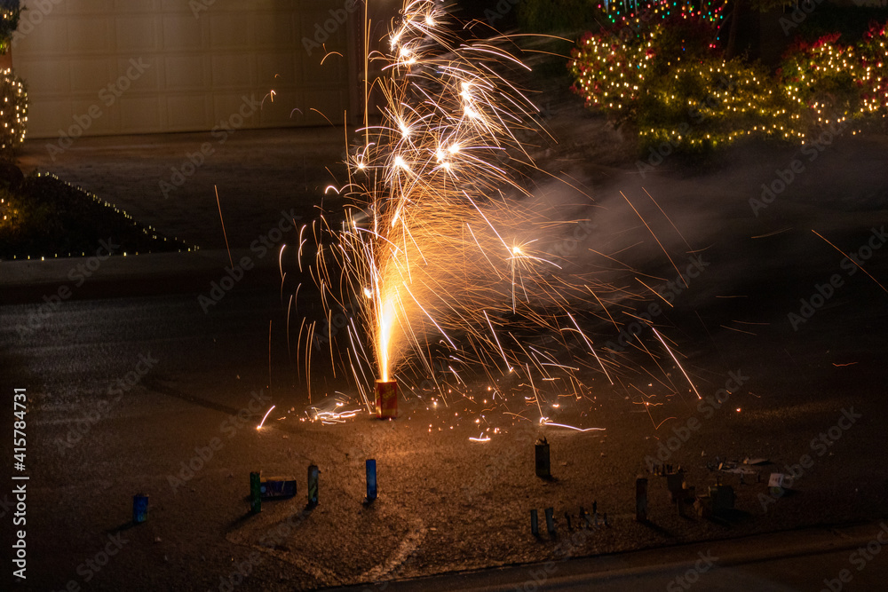 Family celebration of holiday with fireworks in driveway Stock Photo ...