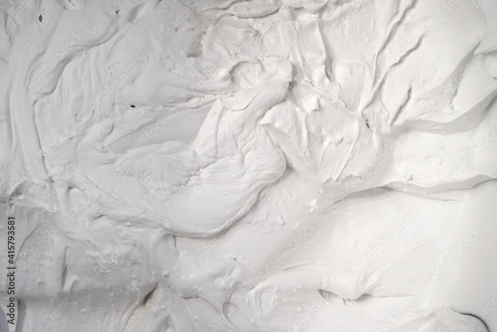 White rough surface with hard texture, putty, foam, background with ...