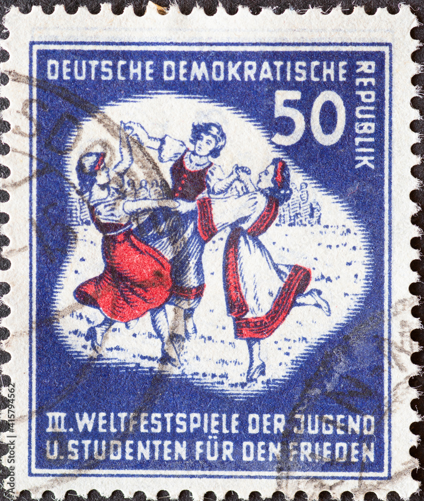 GERMANY, DDR - CIRCA 1951 : a postage stamp from Germany, GDR showing a folk dance group. III ...
