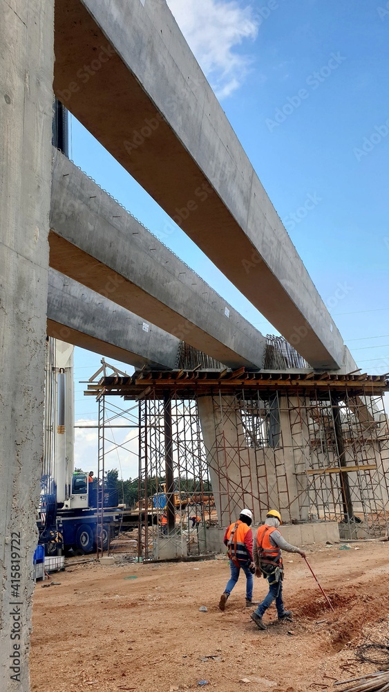 workers on a site, installers , after the installation of the bridge ...