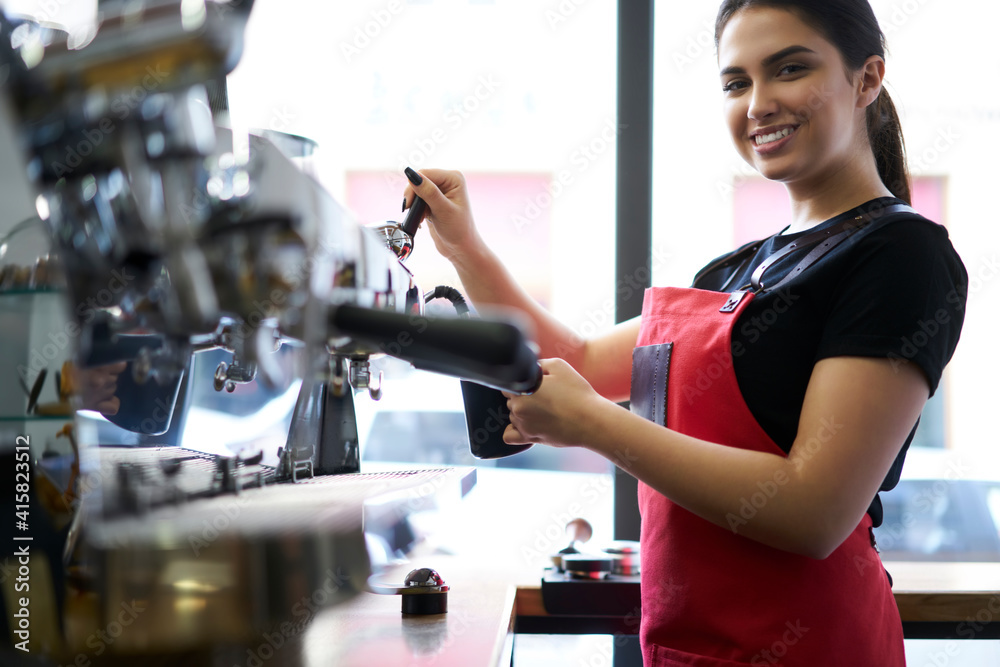 Portrait of cheerful caucasian woman employee enjoying using ...