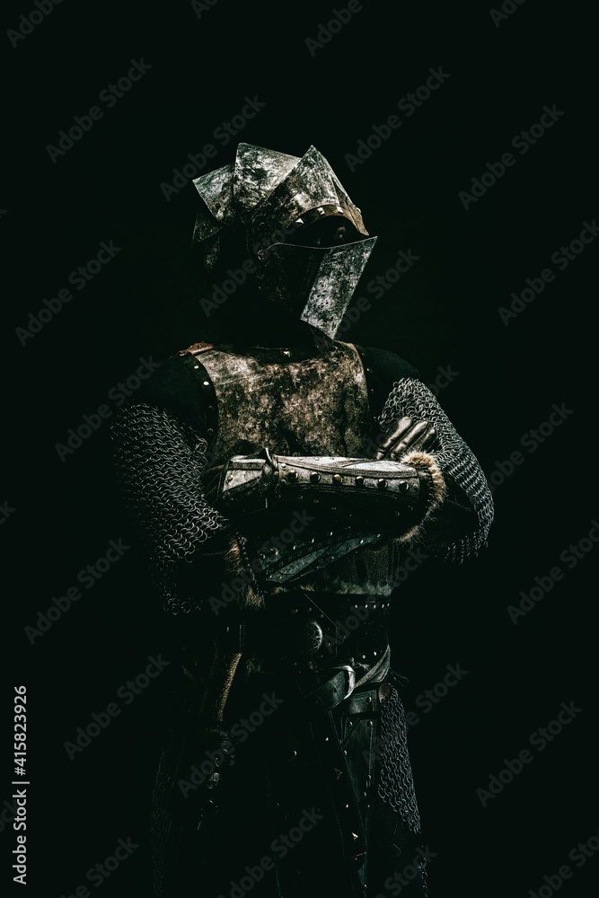 Portrait of a medieval fighter in armor with his arms crossed Stock ...
