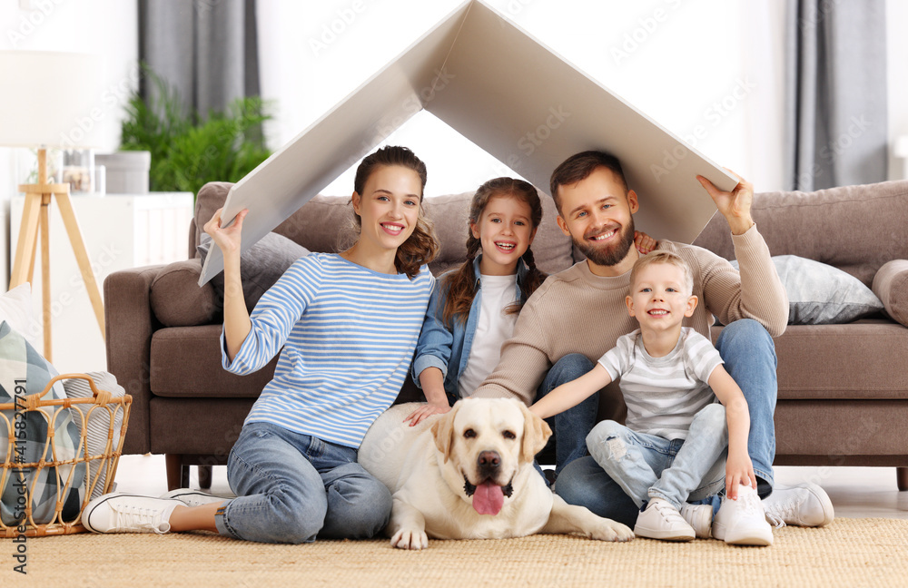 Happy family with dog enjoying new home Stock Photo | Adobe Stock