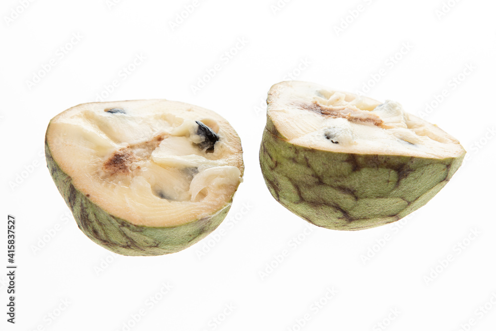 Custard apple (cherimoya) cut in half isolated on white background ...