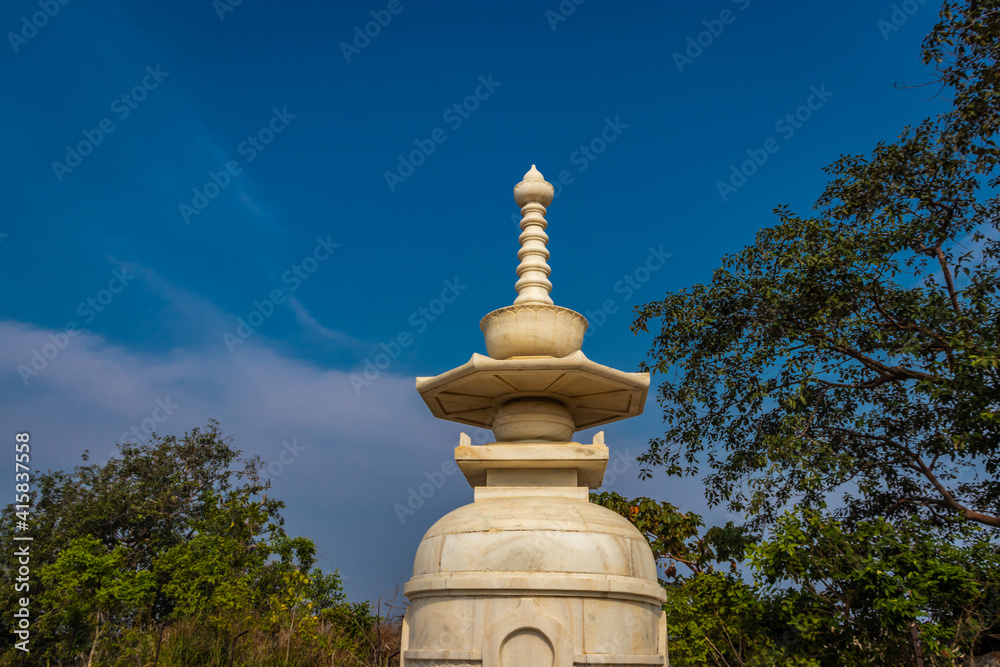 buddhist stupa isolated with amazing blue sky from unique perspective ...