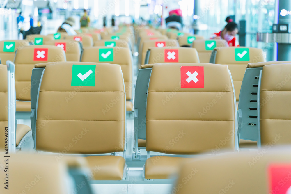 Rows of empty seats with indicator sign showing where to sit and keep ...