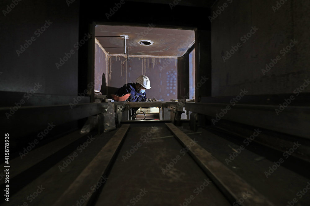workers work in a factory on a production line Stock Photo | Adobe Stock