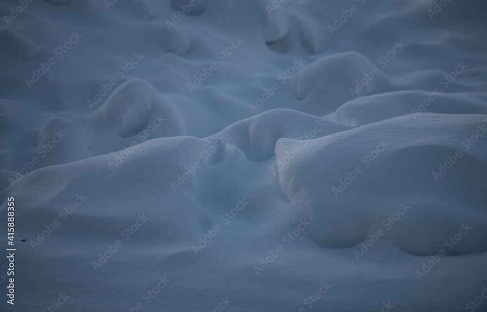 snow landscape made from mounds of snow and snow drifts sunlight ...