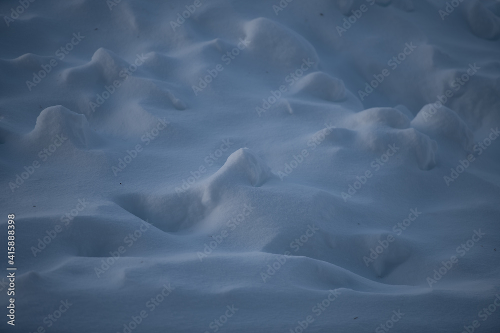 snow landscape made from mounds of snow and snow drifts sunlight ...