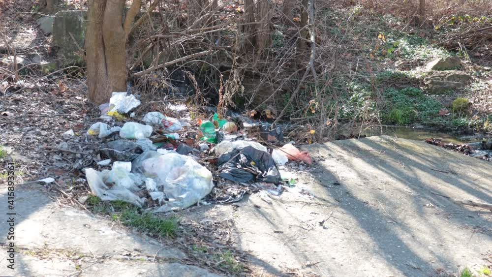 Pile of trash or garbage dumped on the ground near the source of the ...