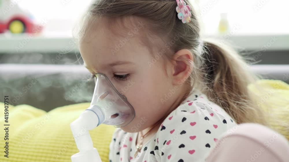 close up Caucasian 3-4 years minor preschool girl kid in the mask of an ...