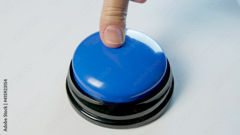 Young woman pushing blue button with a finger and palm of her hand ...