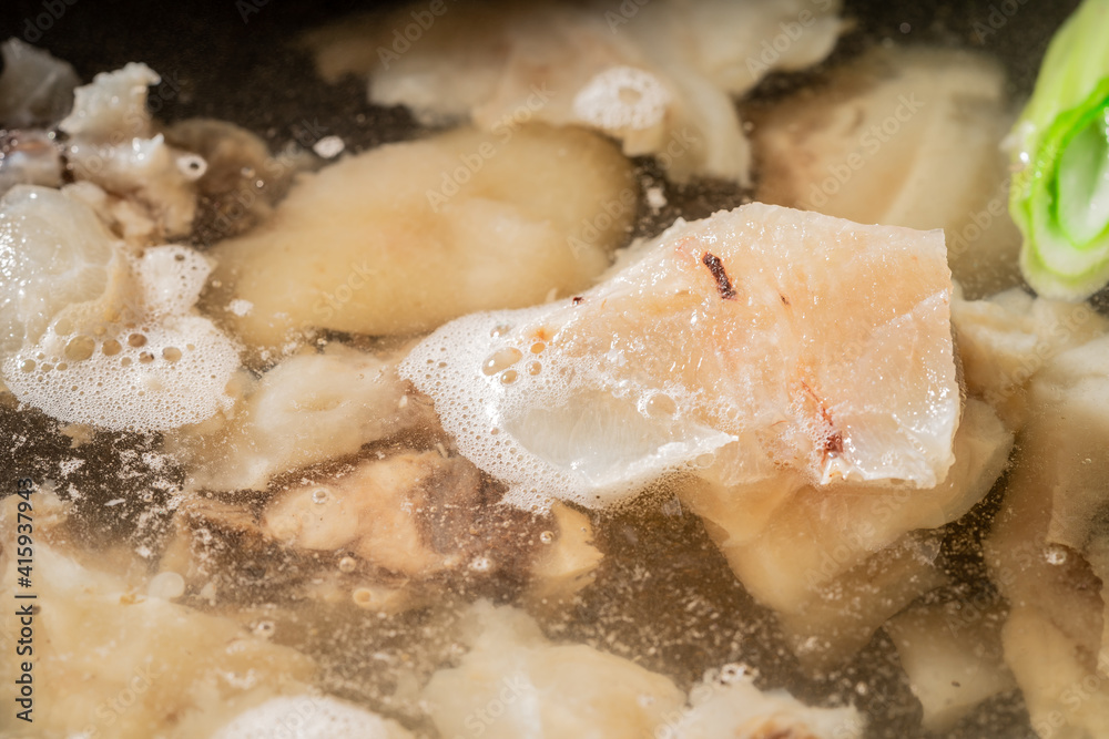 Beef and beef tendon being cooked in water Stock Photo | Adobe Stock