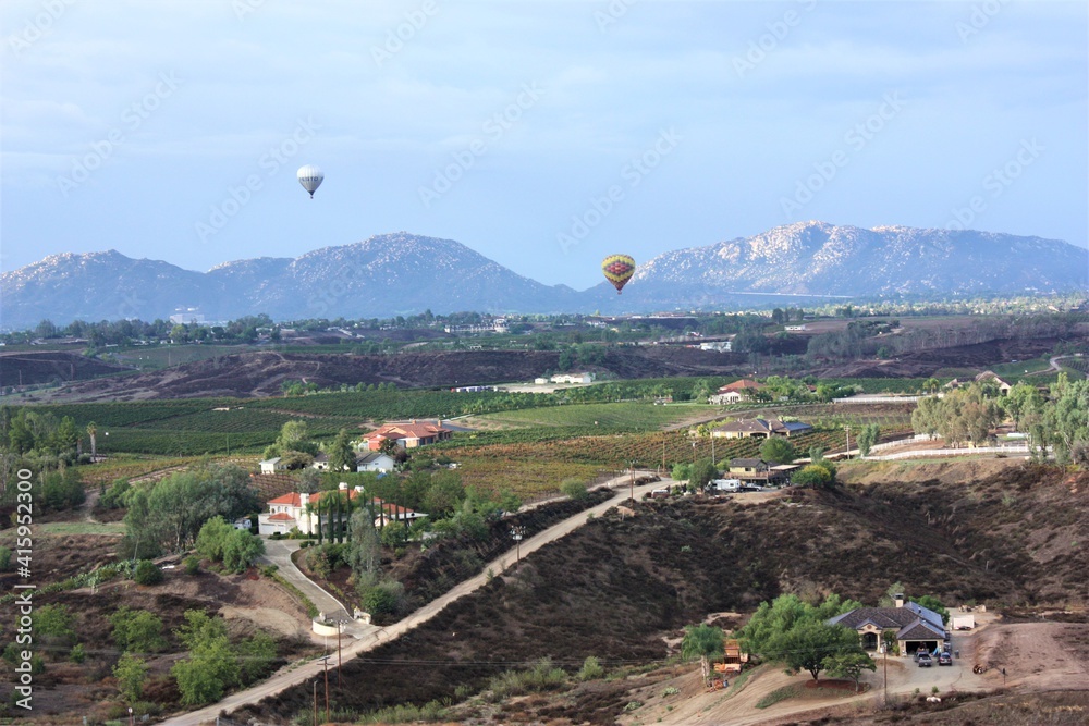 Colorful hot air balloon flying on blue sky background at Temecula in ...