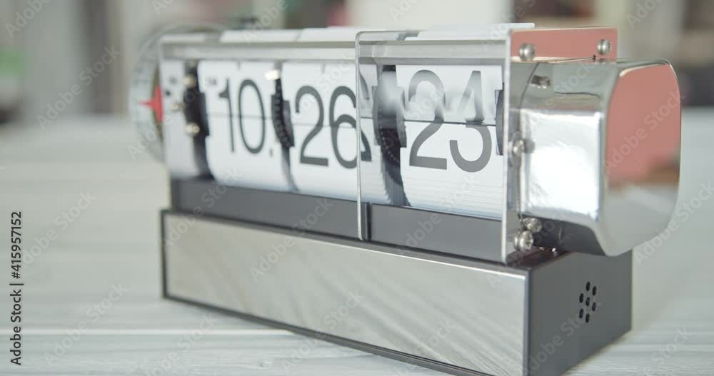 Video Stock Flip clock or flap clock on white table. An ...