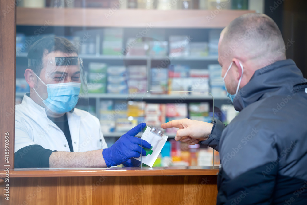 Pharmacist working. Protection in pharmacies. Working in an Alarm State ...