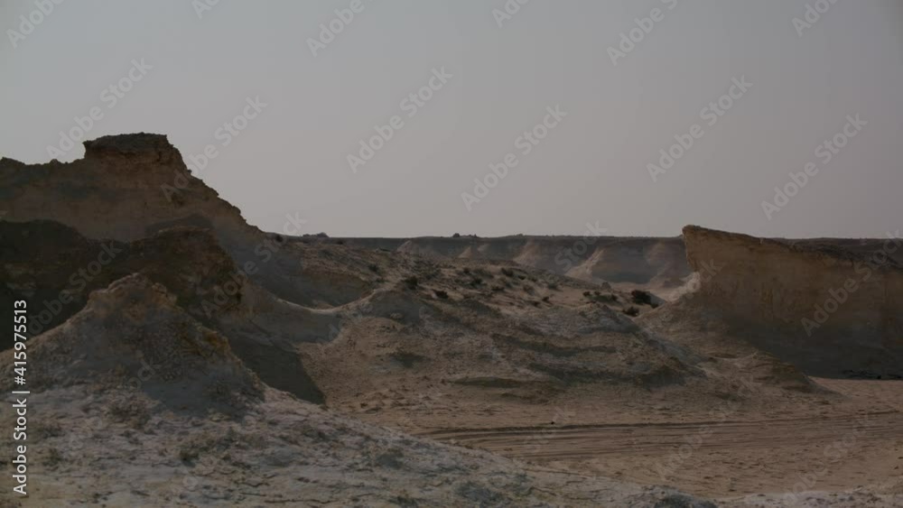 Camera sliding from left to right showing the rocky area in Zekreet ...