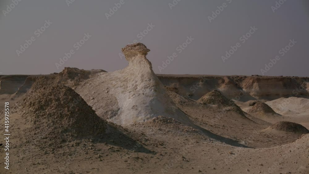 Camera sliding from left to right showing the rocky area in Zekreet ...