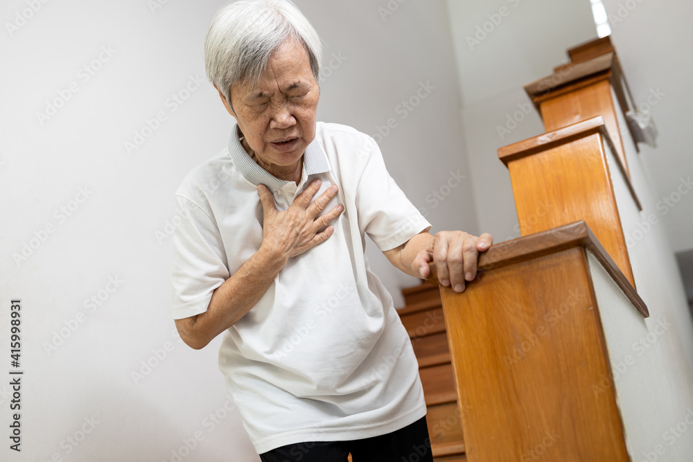 Asian senior grandmother suffering from pain in chest with acute ...