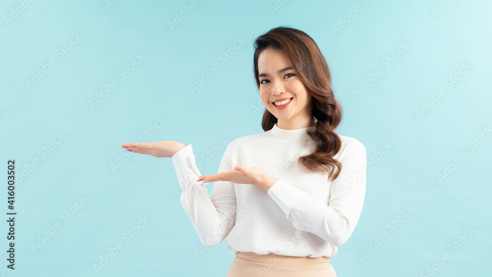 Portrait of Asian beautiful young girl raising both hands aside show ...
