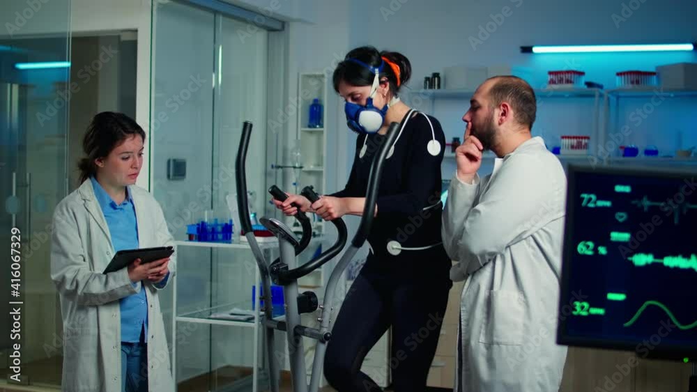 Team of professional doctors measuring health conditions of woman ...