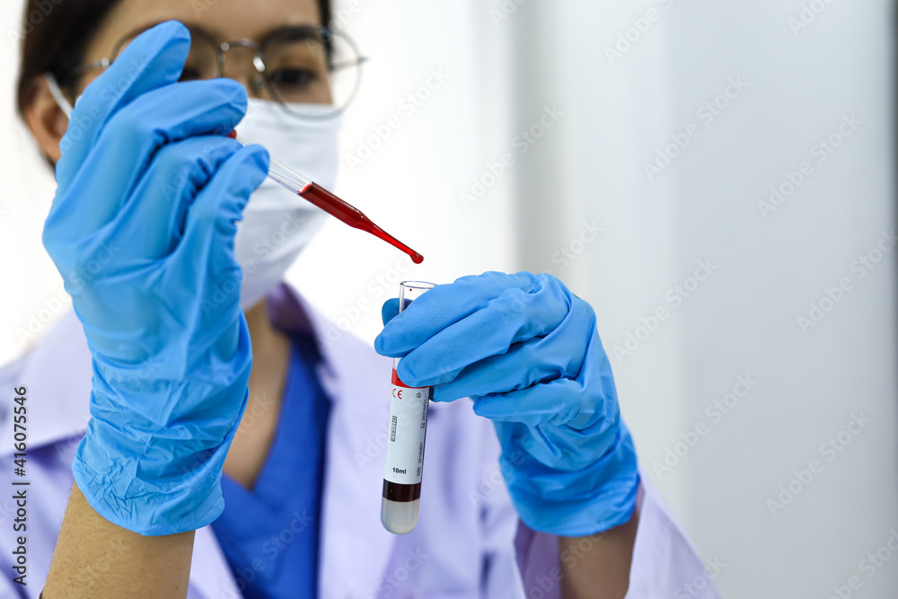 Scientist holding Coronavirus covid-19 infected blood sample tube DNA ...