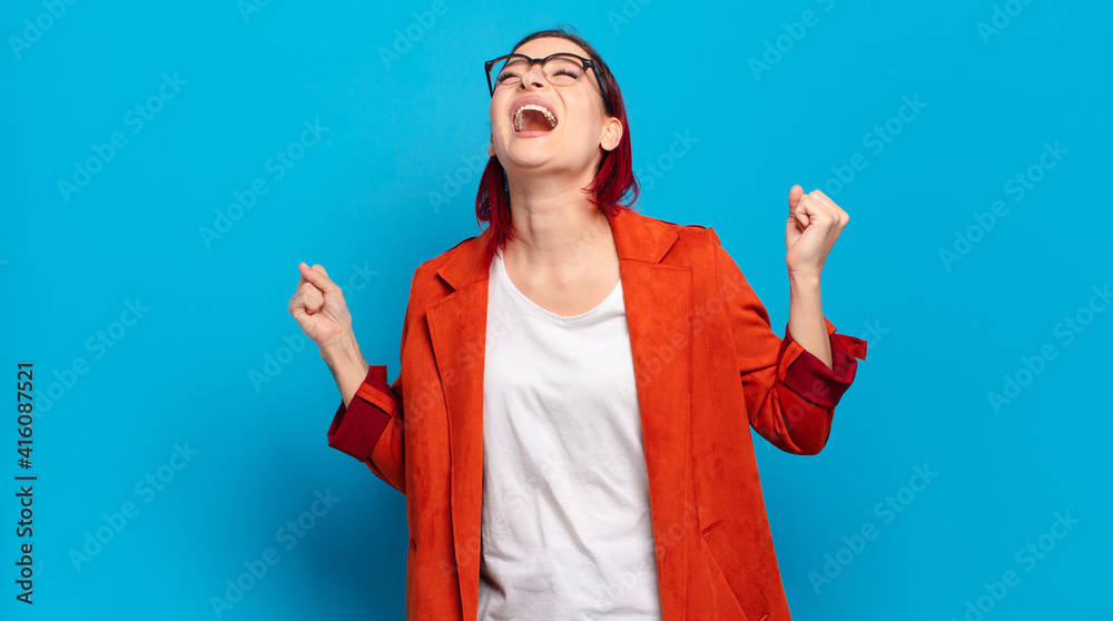 looking extremely happy and surprised, celebrating success, shouting ...