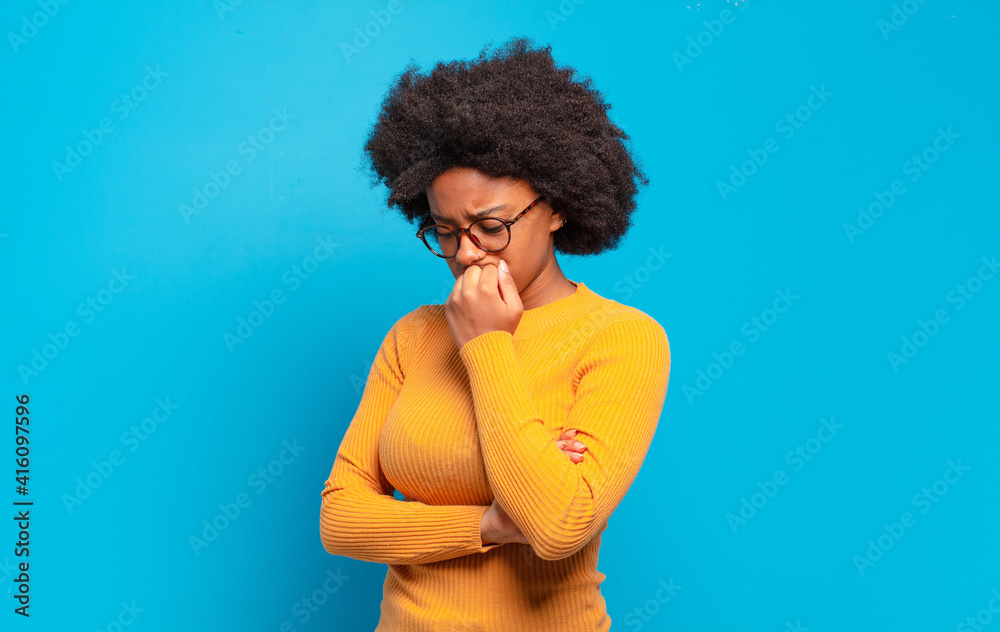 feeling serious, thoughtful and concerned, staring sideways with hand ...