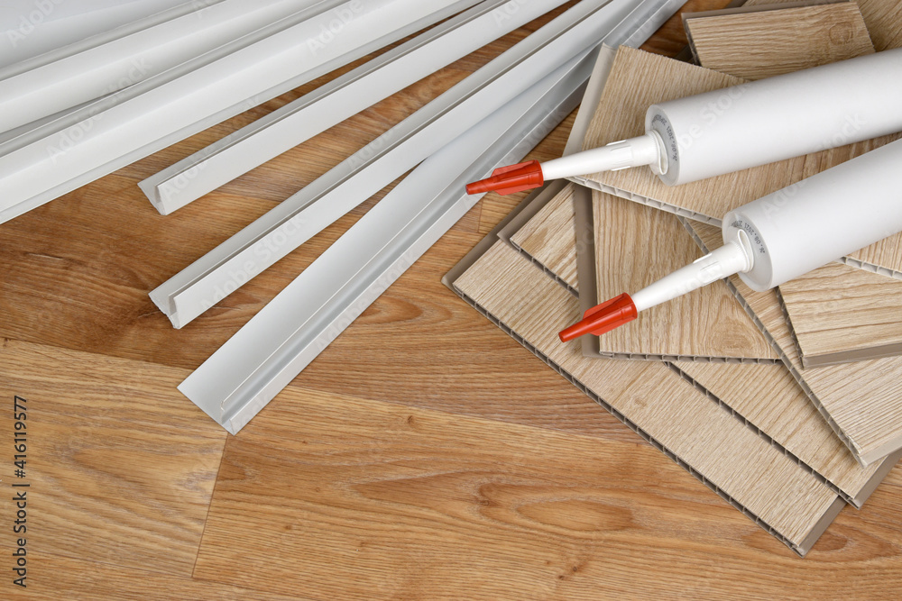 Set of items for PVC ceiling indoor works. Assembly adhesive bottles ...