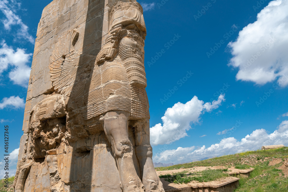 Ruins, statues and murals of ancient persian city of Persepolis in Iran ...