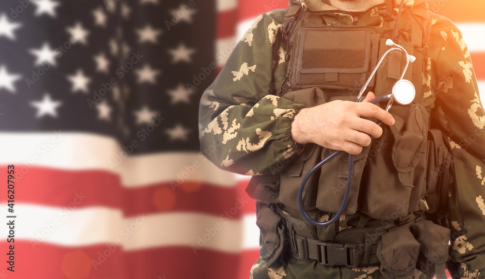 Military doctor and USA flag background .Concept National holidays ...
