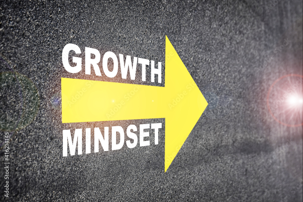 Growth mindset with yellow arrow marking on road surface. Self ...