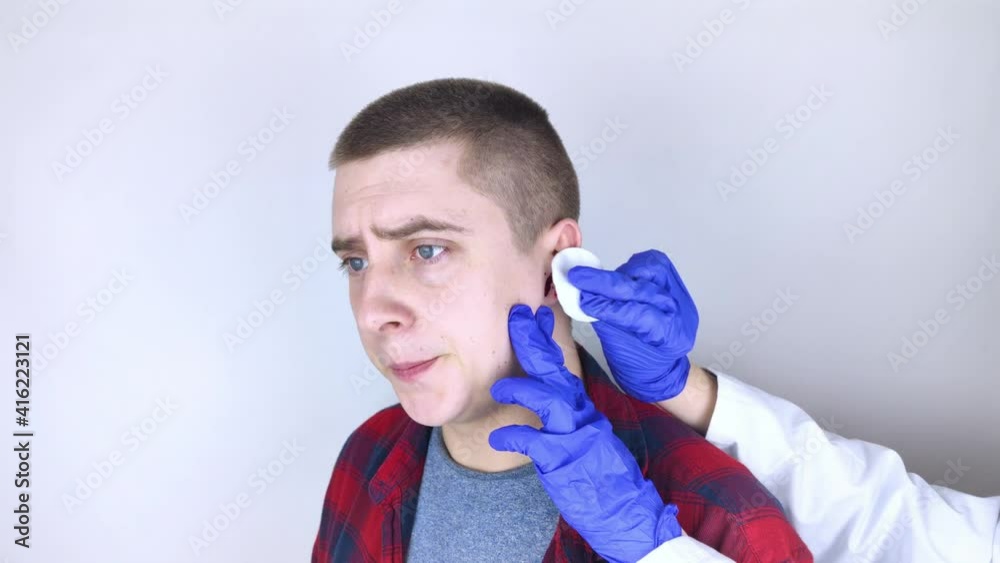 A man whose ear is bleeding. Vascular rupture, damage to the tympanic ...