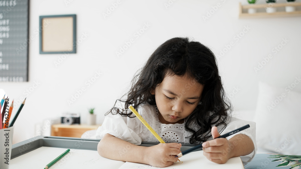 little child is drawing a picture in her imagination. Little children ...