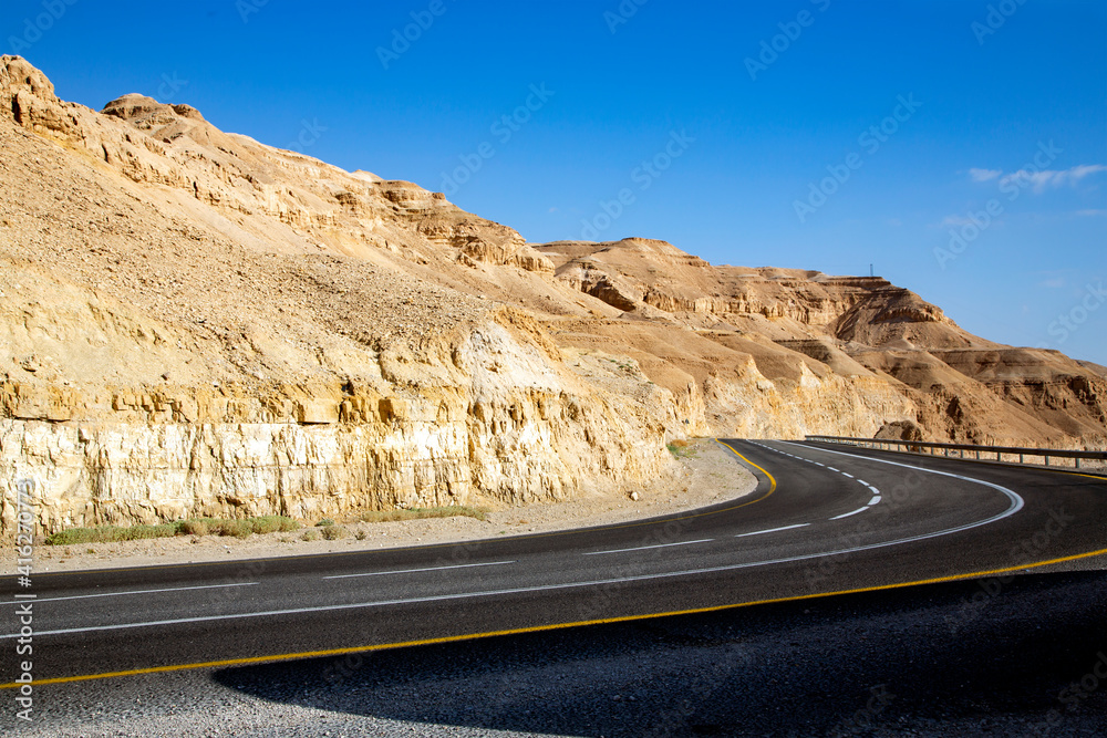 Asphalt winding road in the Judean desert among the Eilat mountains ...
