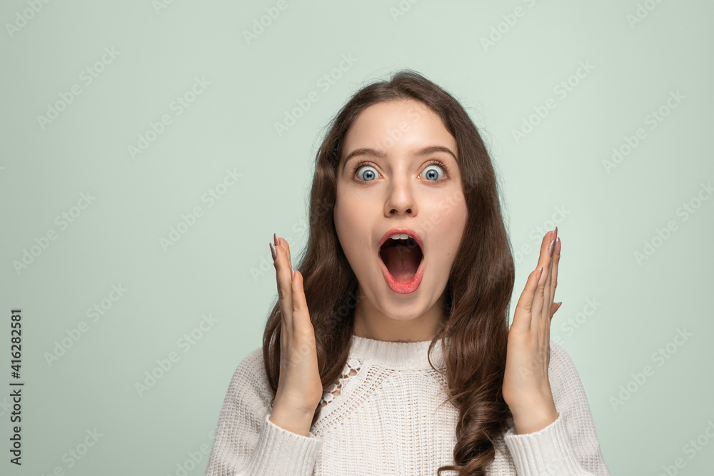 Close up portrait of beautiful darkhaired woman spreading hands ...