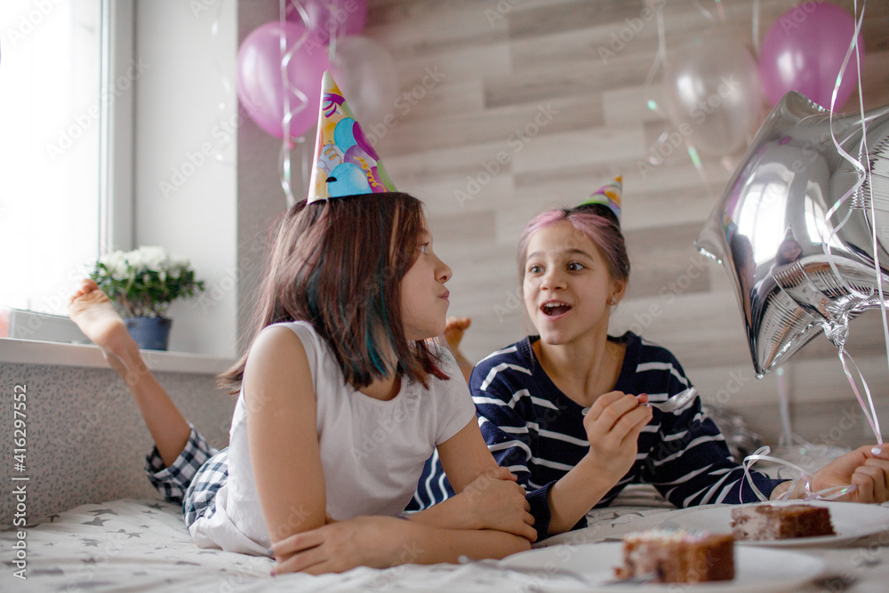 Two preteen sisters twins celebrate birthday day at the morning, active ...