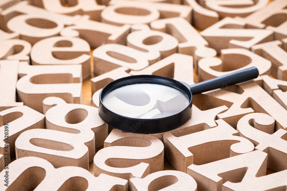 Magnifying on English Wood Alphabets Stock Photo | Adobe Stock