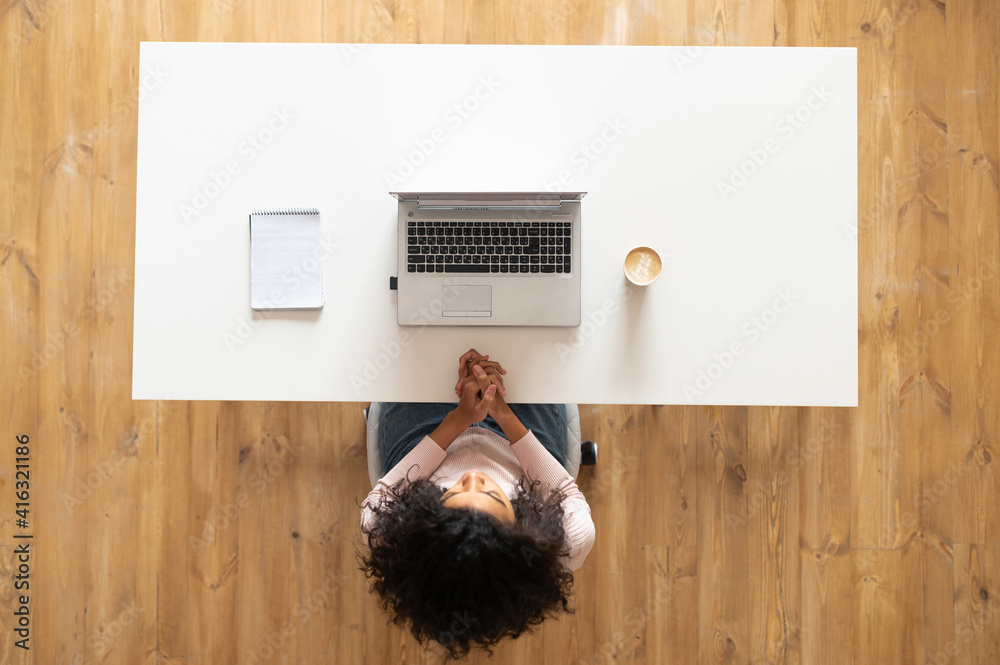Overhead view of African American woman or female office worker with ...