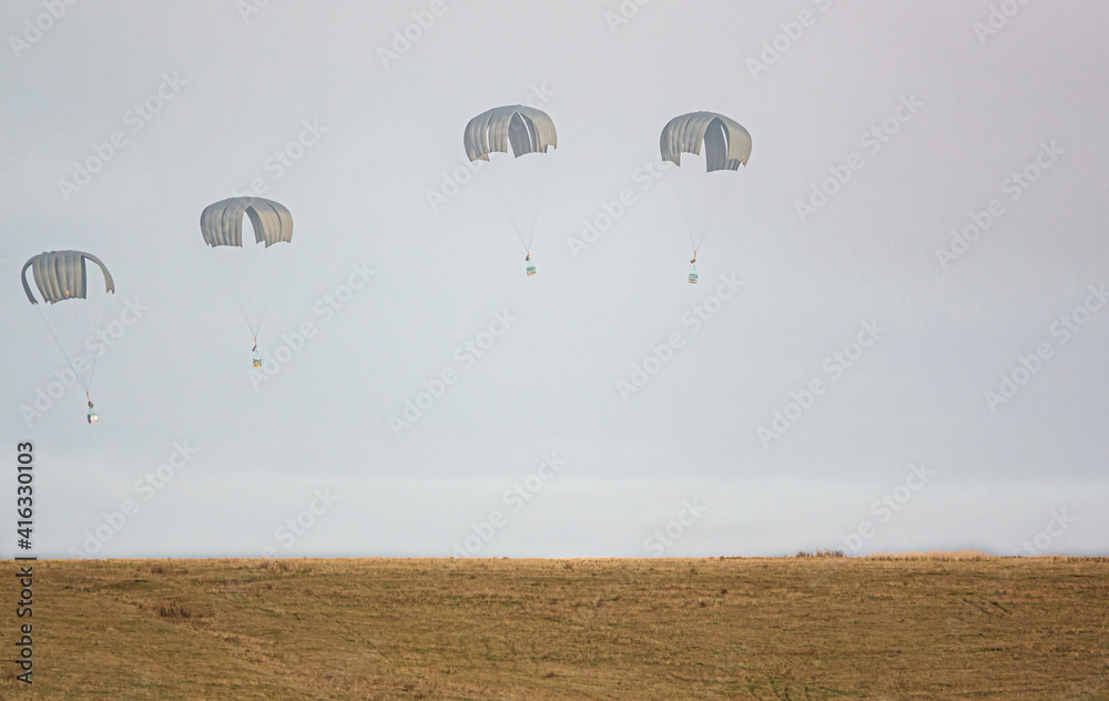 four 1-tonne heavy cargo loads dropped by parachute from an RAF Airbus ...