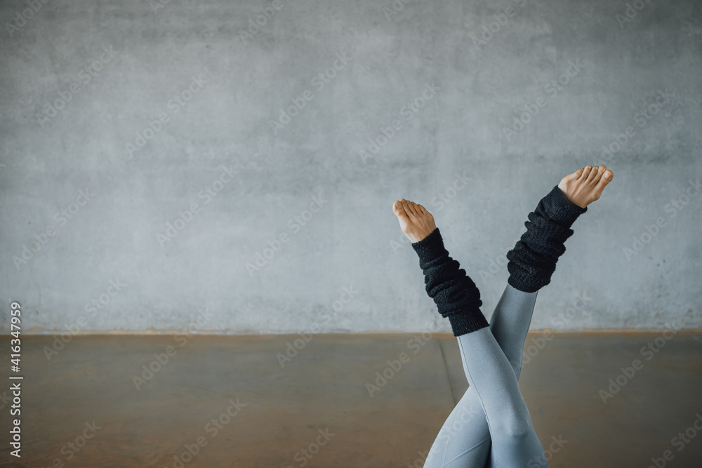 Close up detailed shot of female feet barefoot, crossed, up side down ...